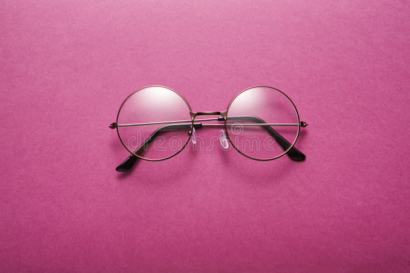 Glasses In Round Thin Metal Frame Isolated On Violet Surface Stock Image Image Of Bookkeeping