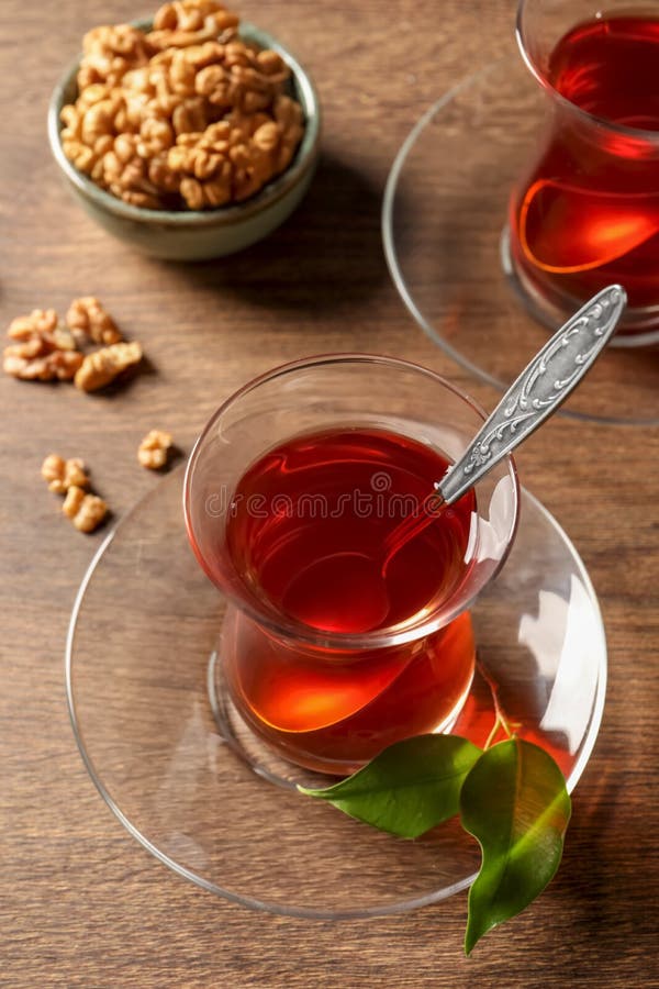Glasses of Traditional Turkish Tea and Walnuts on Wooden Table, Above ...