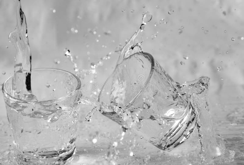 Glasses of Water Falling and Jumping with Splashes and Drops Stock ...