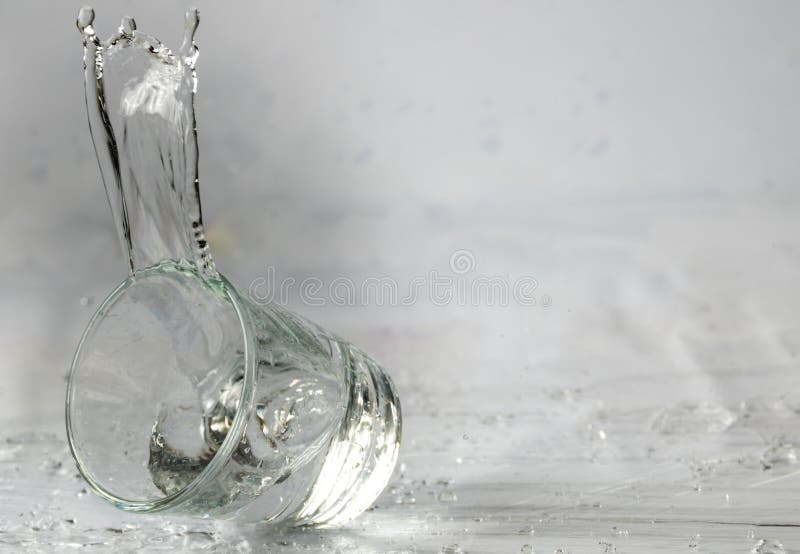 Glasses of Water Falling and Jumping with Splashes and Drops Stock ...