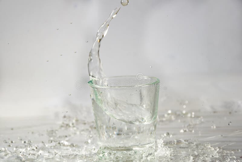 Glasses of Water Falling and Jumping with Splashes and Drops Stock ...