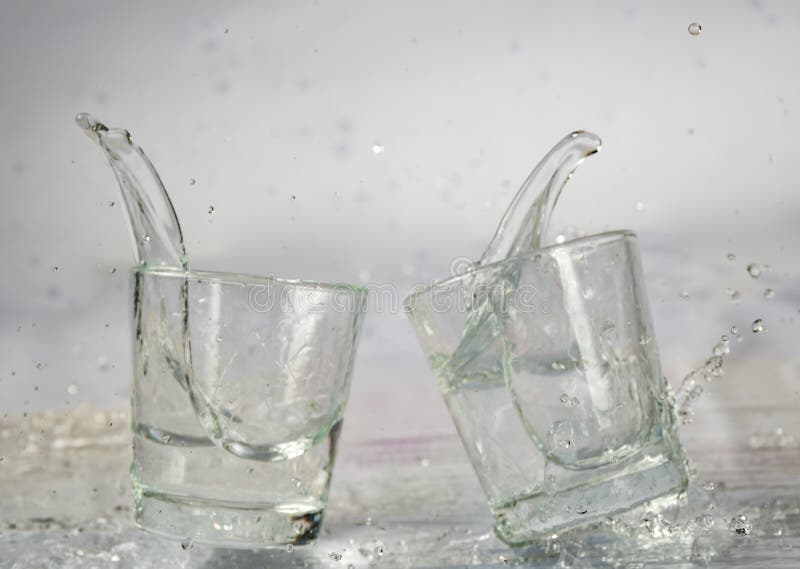 Glasses of Water Falling and Jumping with Splashes and Drops Stock ...