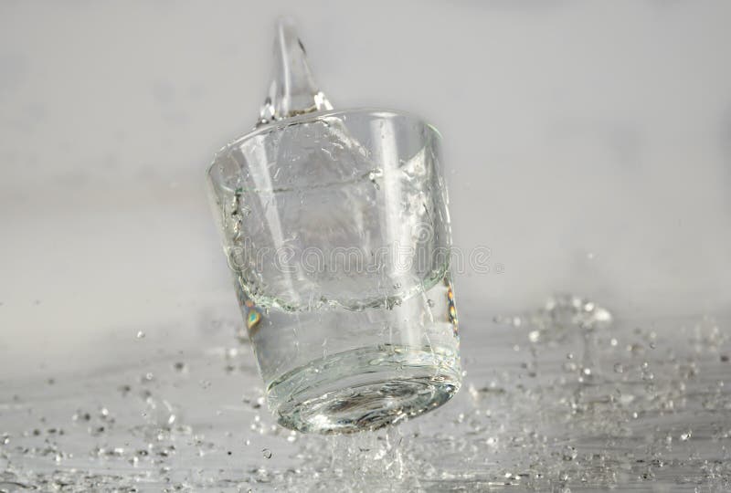 Glasses of Water Falling and Jumping with Splashes and Drops Stock ...