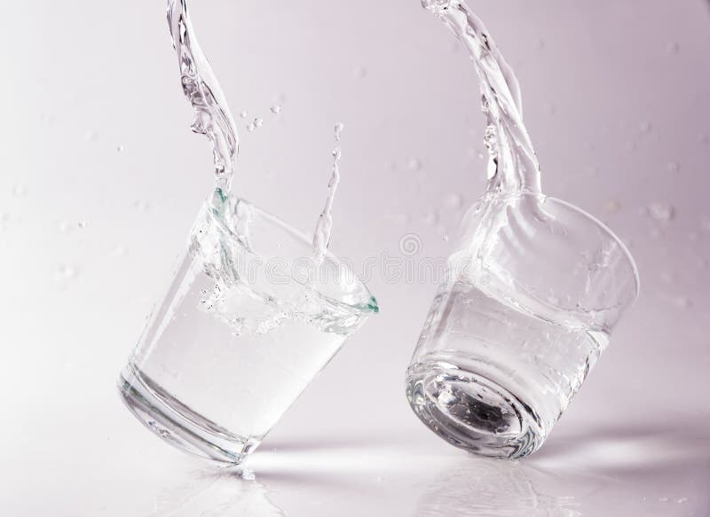 Glasses of Water Falling and Jumping with Splashes and Drops Stock ...