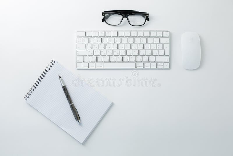 Glasses White Keyboard Mouse Notepad and Pen on White Background Stock ...