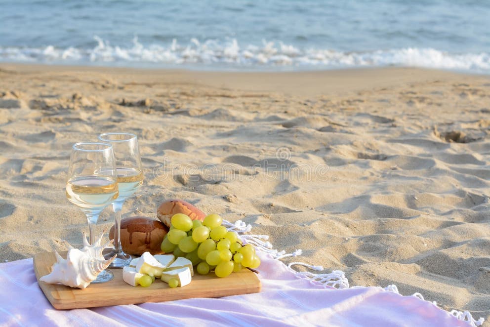 Glasses with White Wine and Snacks on Sandy Seashore. Space for Text ...