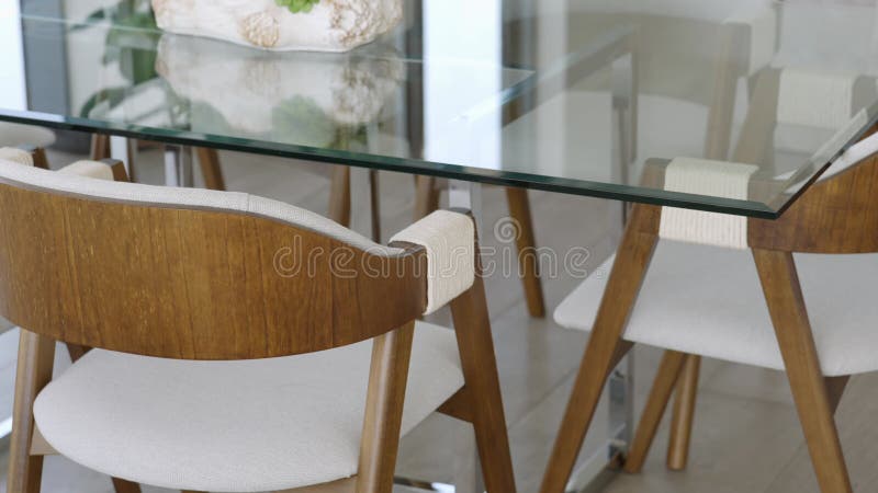 Glassy Dining Table with Sharp Angles Standing on Light Floor Covering ...