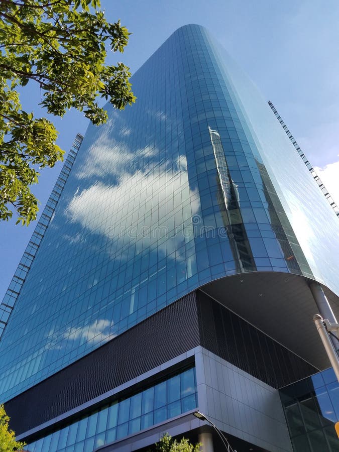 Glassy Skyscraper stock image. Image of glassy, reflection - 116648217