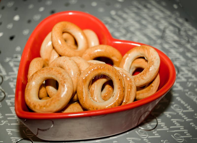 Glazed Bagels on Red Plate in Shape of Heart. Stock Photo - Image of ...