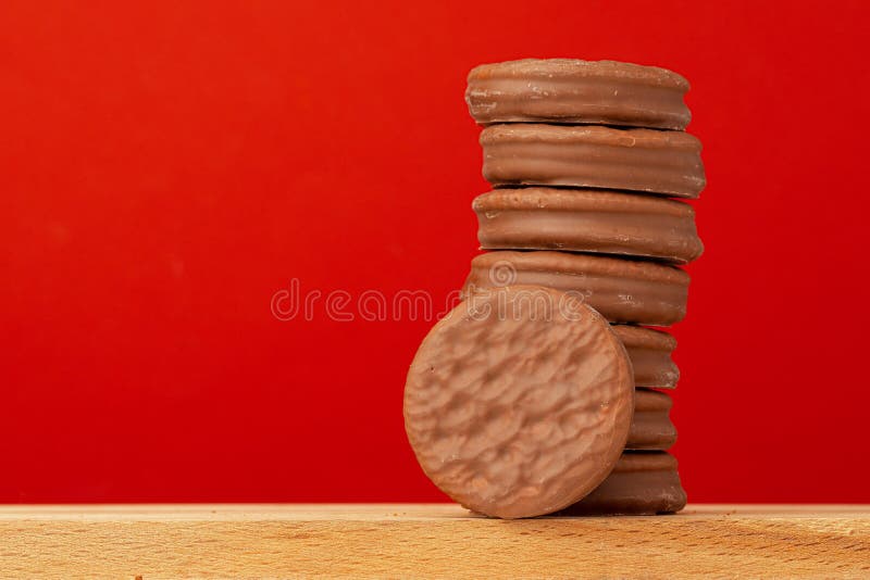 Glazed Chocolate Cookies Stack on Red Background Stock Photo - Image of ...