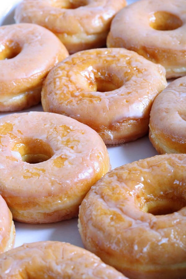Glazed doughnuts vertical stock photo. Image of unhealthy - 14935332