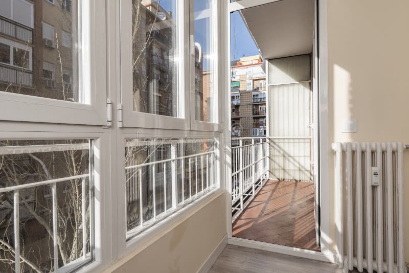 Glazed Part of a Terrace Next To a White Aluminum Exit Door To the Open ...