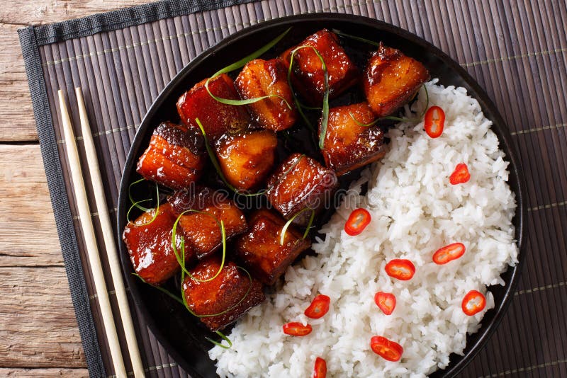 Glazed Pork Belly with Rice Close-up on a Plate. Horizontal Top Stock ...