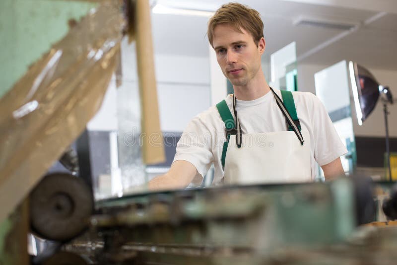 Glazier Grinding a Pieco of Glass Stock Photo - Image of caucasian ...