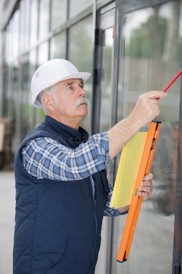 Glazier Inspecting Wall Glass Stock Image - Image of construction ...