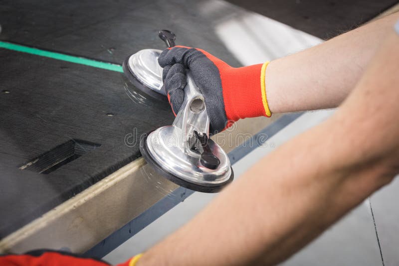 .the Glazier Uses a Sucker for Windows. Glass Making Workshop, the Man ...