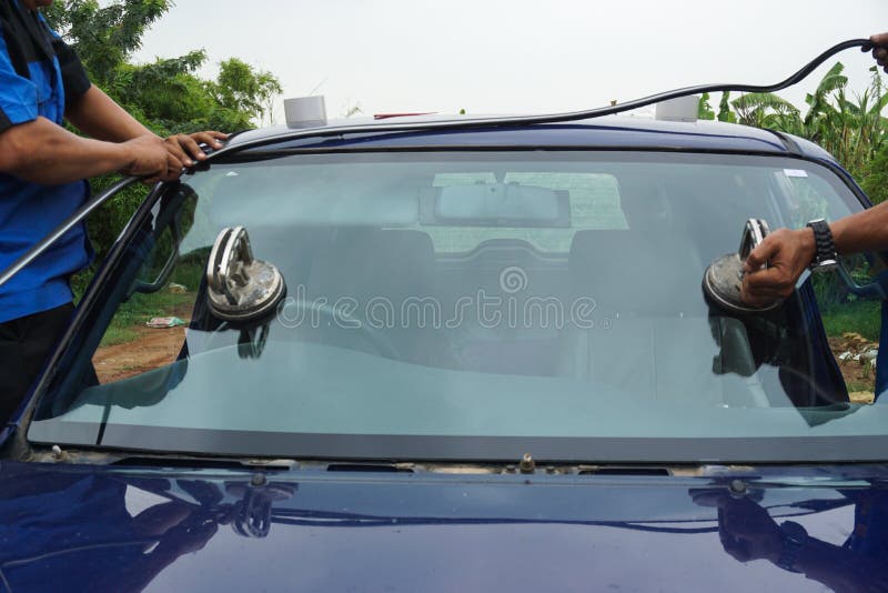 Glazier Using Tools Repairing To Fix Crack Broken Windshield, Wi Stock ...