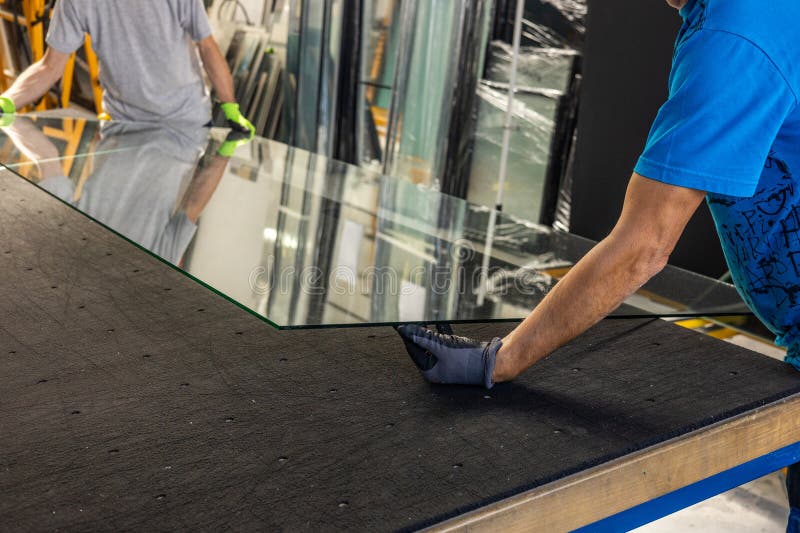 Glaziers Place a Large Sheet of Thick Glass on the Table by Hand. Glass ...