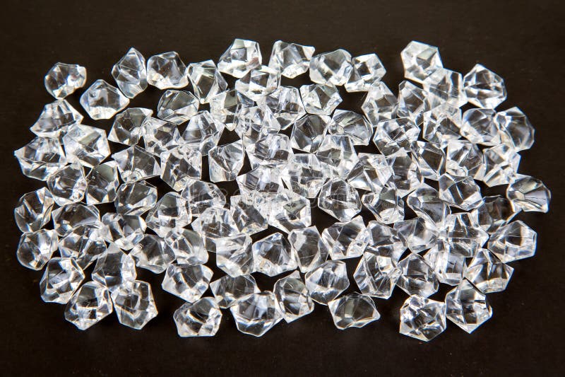 Gleaming Transparent Crystals on a Dark Surface, Reflecting Light with ...