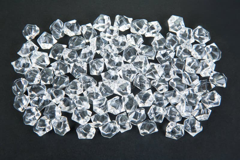 Gleaming Transparent Crystals on a Dark Surface, Reflecting Light with ...