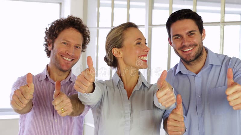 Gleeful Colleagues Showing Thumbs Up To Camera Stock Footage - Video of ...