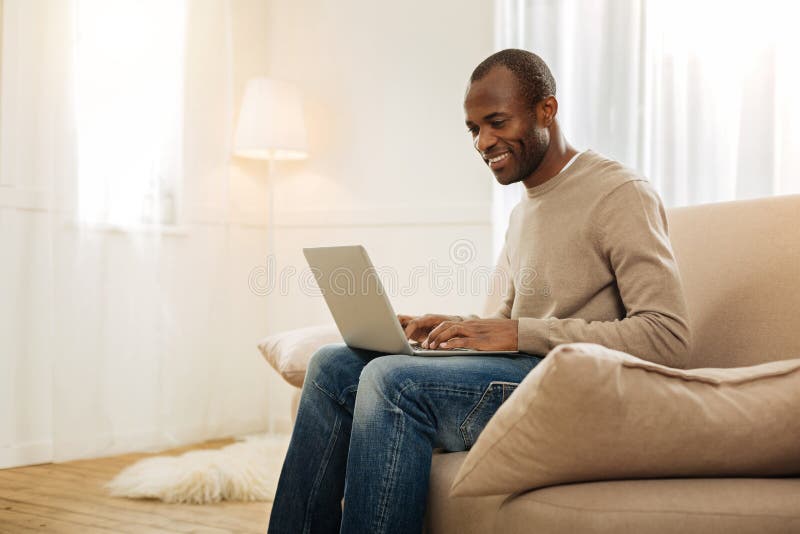 Gleeful Man Typing on the Laptop Stock Image - Image of device ...