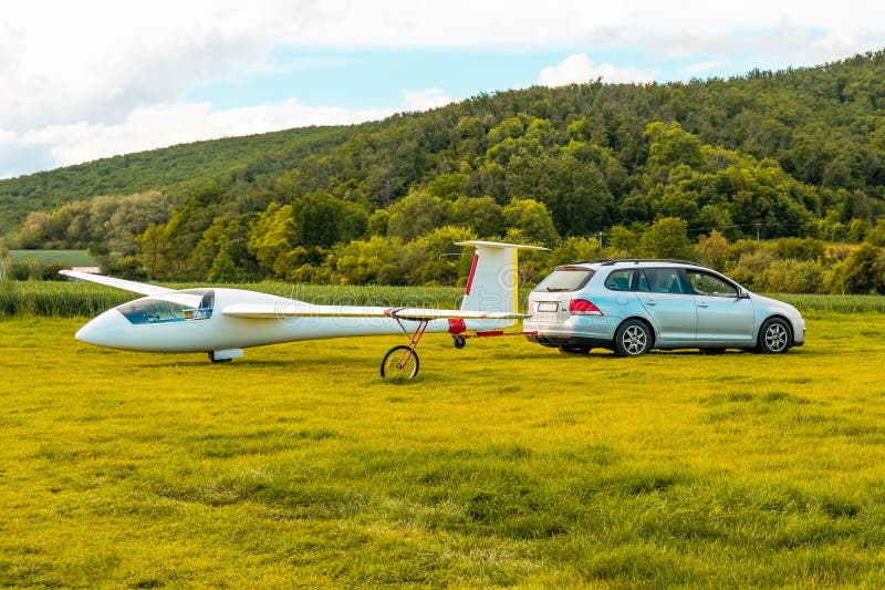 A Glider Attached To a Car Being Dragged. Transporting Airplane with ...