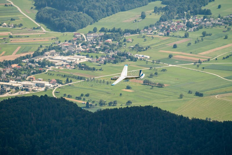 Glider flying over forest stock image. Image of glider - 95850809