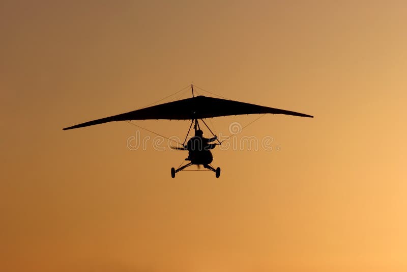 Motor Hang Glider in the Cloudy Sunset Stock Photo - Image of ...