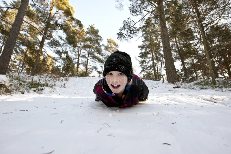 Gliding in the Snow on Belly Stock Image - Image of smiling, seasonal ...