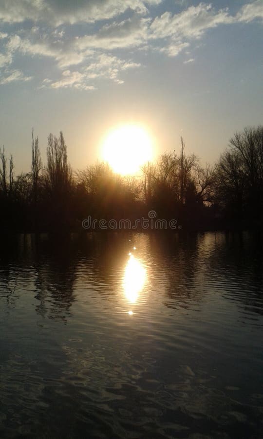 Glimmering sunset stock photo. Image of reflection, sunset - 195294296