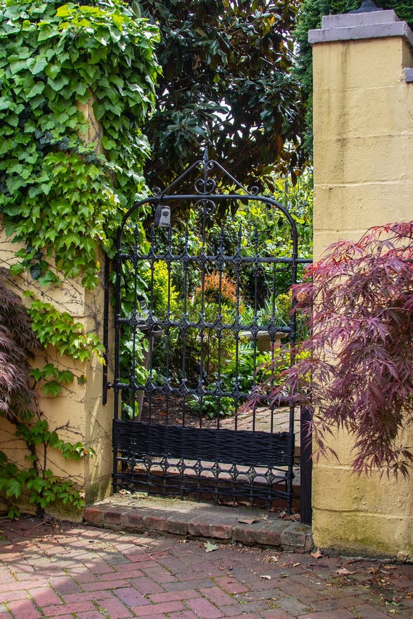 A Glimpse through the Gate of a Spring Time Garden. Stock Image - Image ...