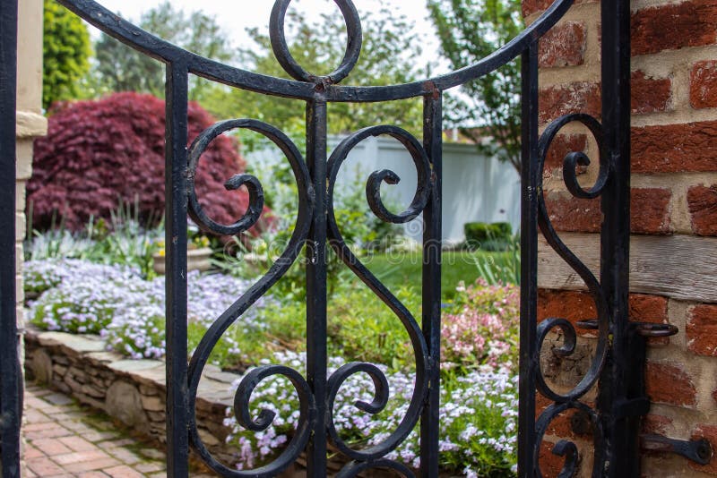 A Glimpse through the Gate of a Spring Time Garden. Stock Photo - Image ...