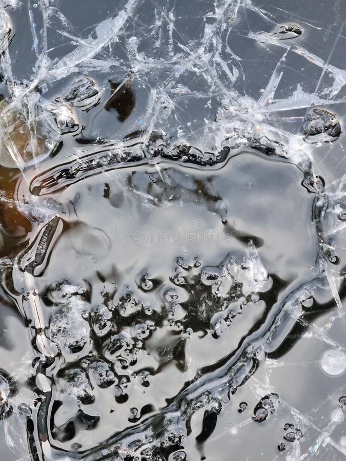 Glitter of Water in the Ice Hole. Broken Ice and Water Texture Stock ...
