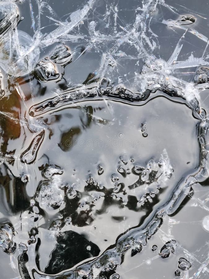 Glitter of Water in the Ice Hole. Broken Ice and Water Texture Stock ...
