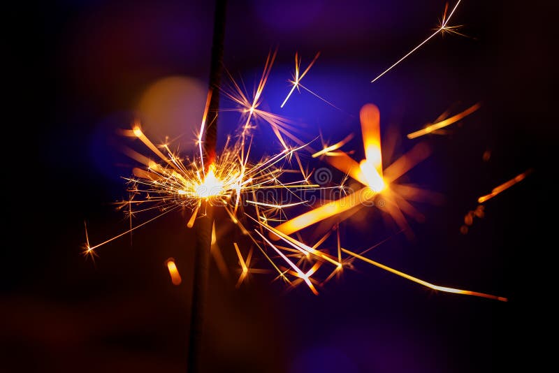 Purple Sparkler Countdown on Fire with Spread of Glitter Sparks Stock ...