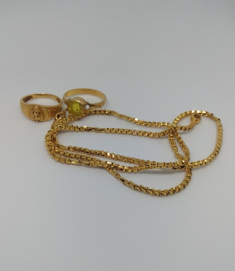Glittering Gold Chain and Rings Stock Photo - Image of jewelry, jewel ...