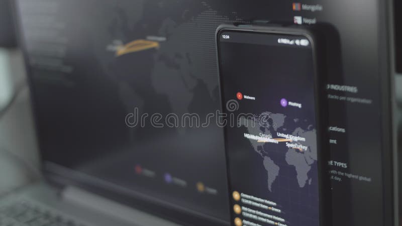 Global Cyber Attack with World Map on Mobile Phone and Computer Screen ...