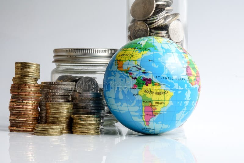 Global Economy Concept with Sphere Globe and Stacked of Coins Over ...