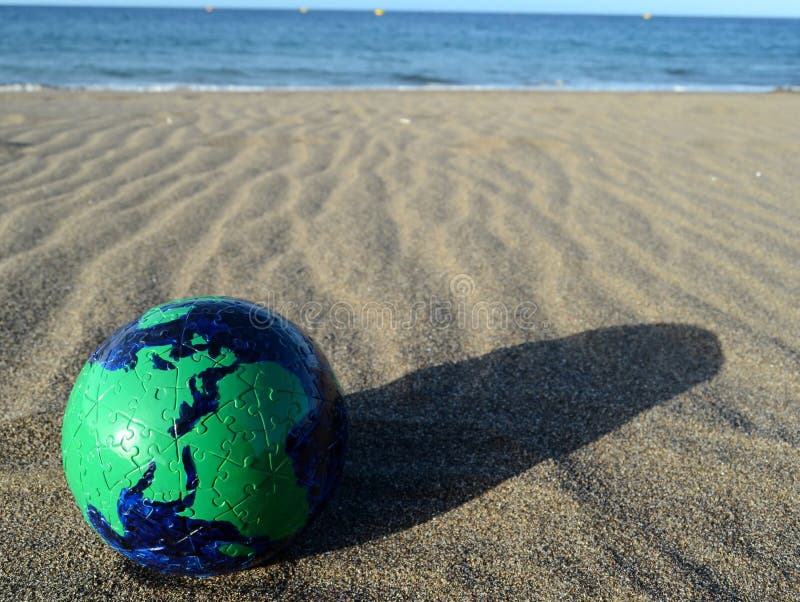 Globe Earth on the Beach stock photo. Image of beach - 241152516