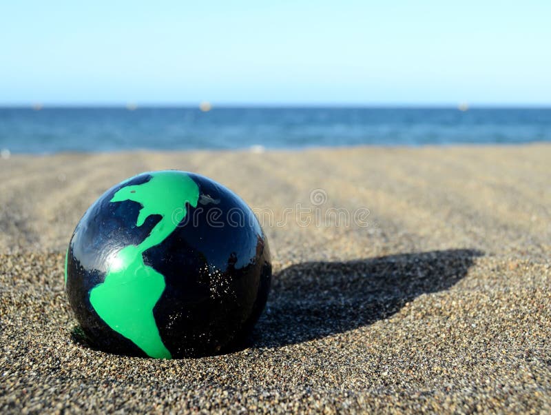Globe Earth on the Beach stock photo. Image of global - 242995078