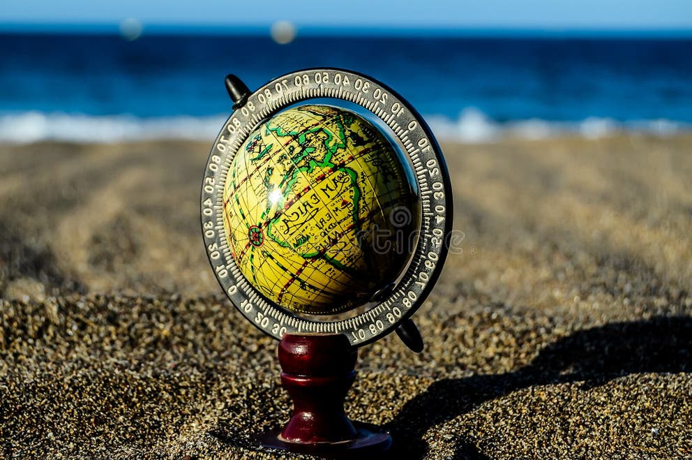 Globe Earth on the Beach stock image. Image of shiny - 357112445