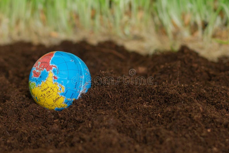The Globe is Lying on the Ground . Earth Day. Planet Earth Stock Photo ...