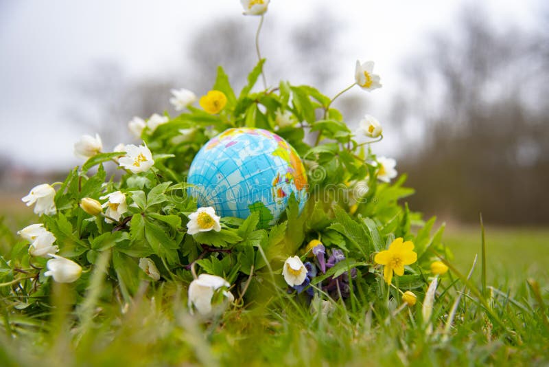 The Globe is Surrounded by Bright Spring Flowers Stock Photo - Image of ...