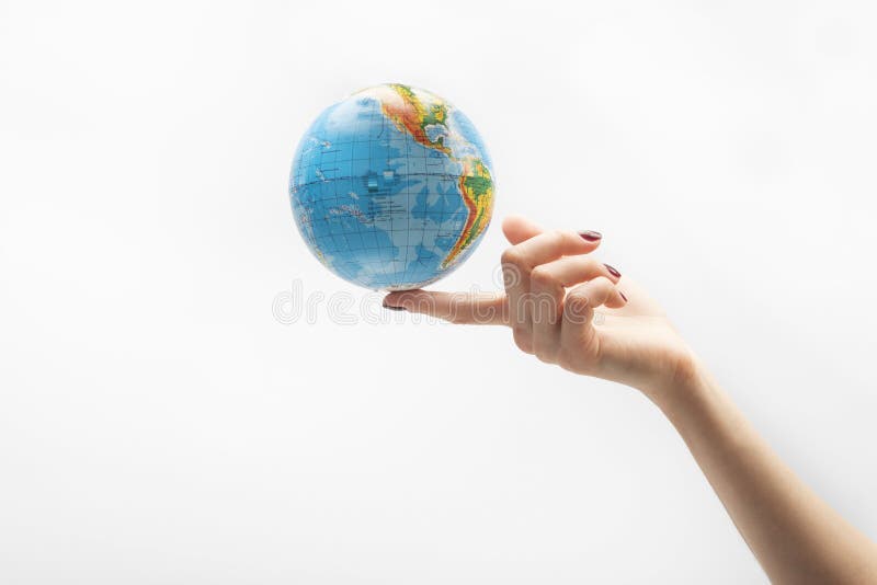 Globe at the Tip of Finger. Female Hand Holds Globe Stock Image - Image ...