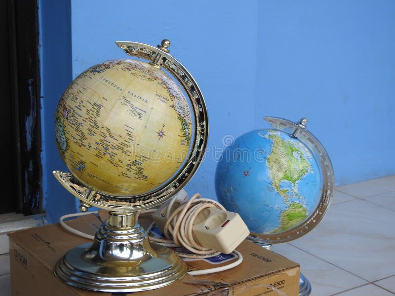 Globe with Two Color Versions Blue and Yellow Stock Photo - Image of ...