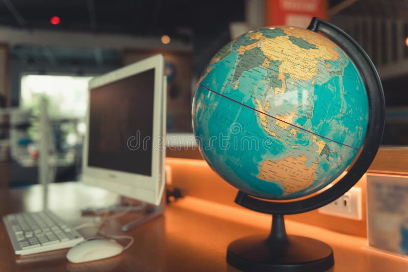 Globe World Map and Computer on Desktop, Around the World Travel Stock ...