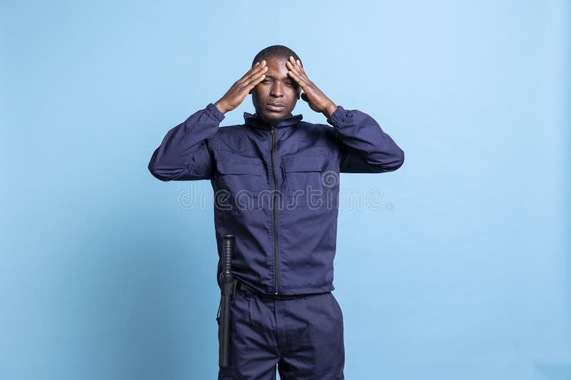 Gloomy Anxious Security Guard Having a Headache while on Duty Stock ...