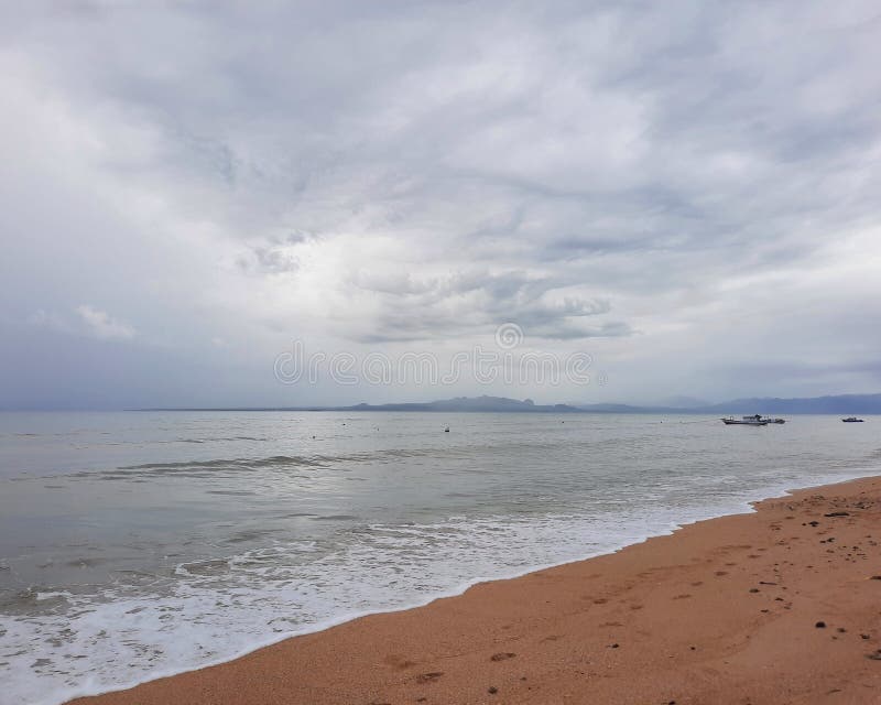 Gloomy days in a beach stock photo. Image of bluesky - 250713532