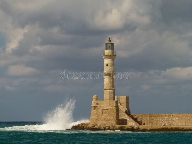 Gloomy Gray Clouds Hang Over the Lighthouse of Yellow and White Bricks ...